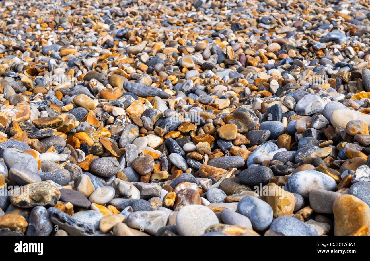 Close up of colourful pebbles on a shingle beach Stock Photo - Alamy