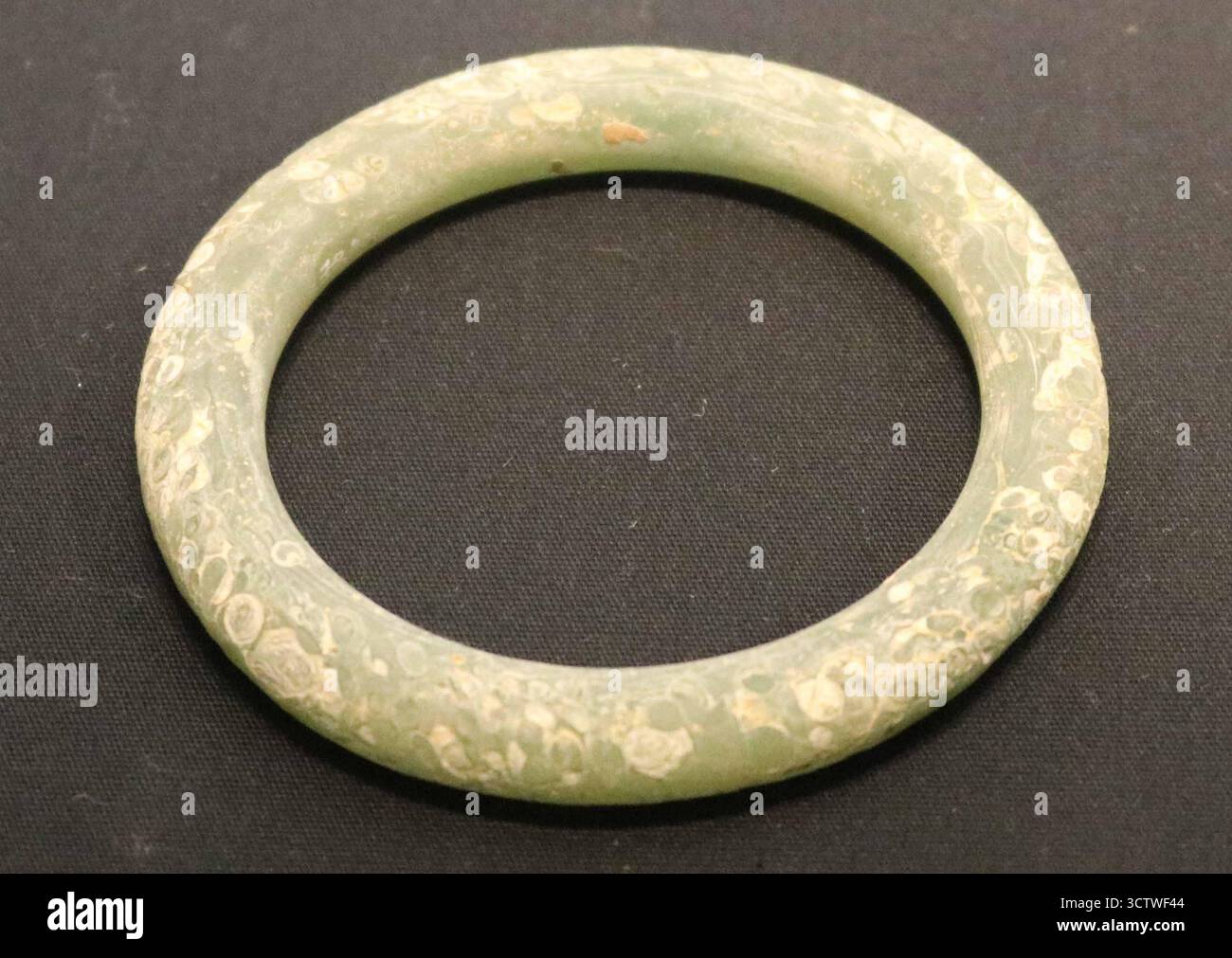 A photograph of a jade bangle from the Three Kingdoms Era of Korea ...