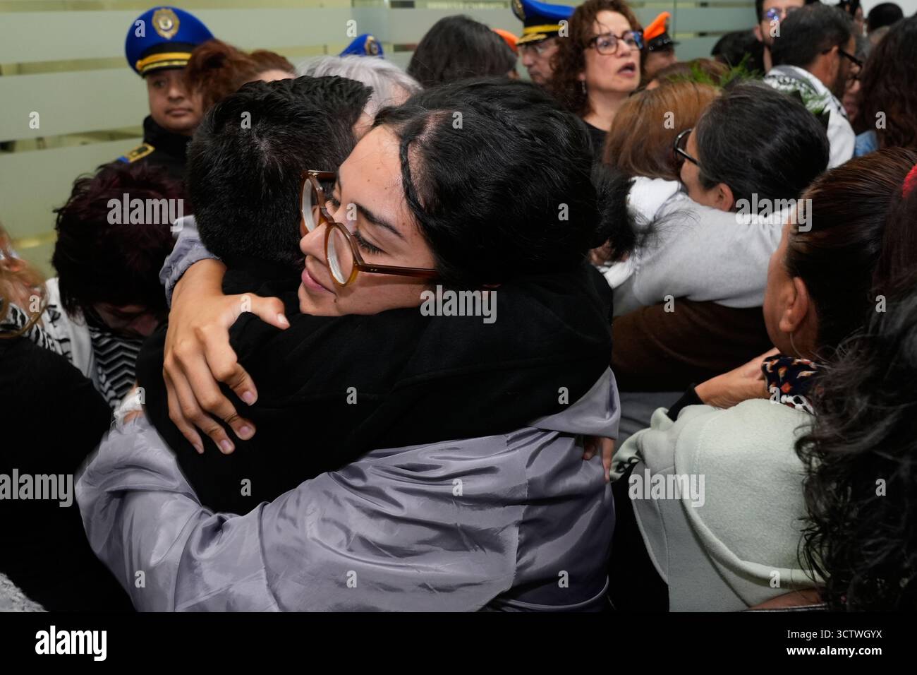 Arlin Medrano Guzman, from Mexico, right, arrives at the Benito Juarez ...