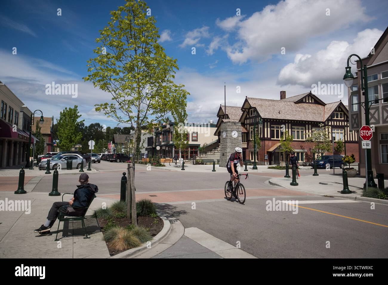 A man watches as a cyclist passes by in Ladner, B.C., on Wednesday May ...