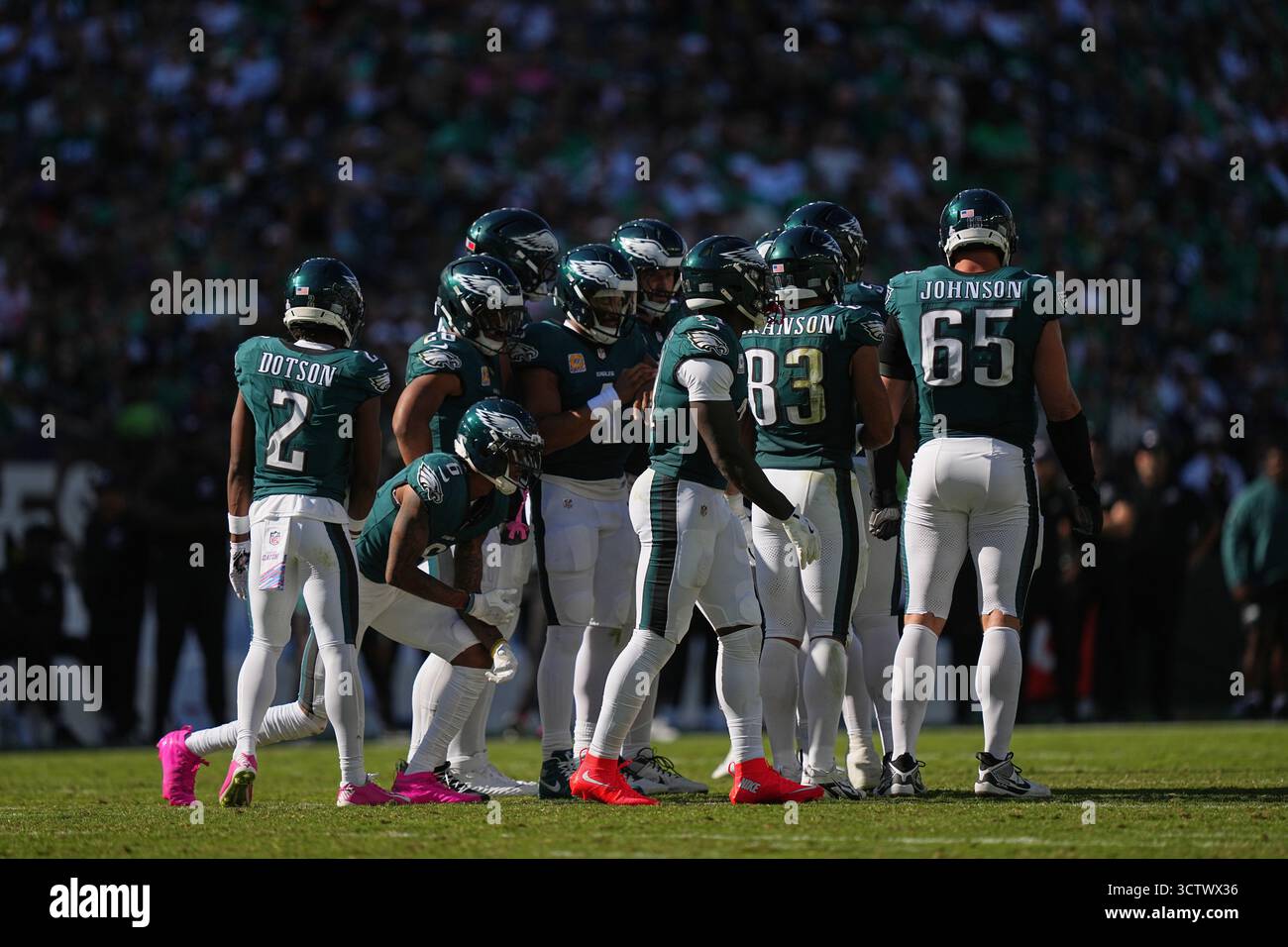 The Philadelphia Eagles huddle during an NFL football game in ...