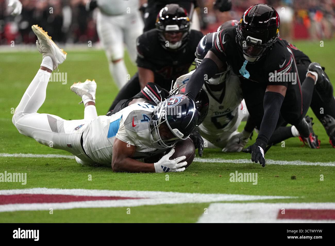 Tennessee Titans wide receiver Tyler Lockett (4) recovers a fumble ...