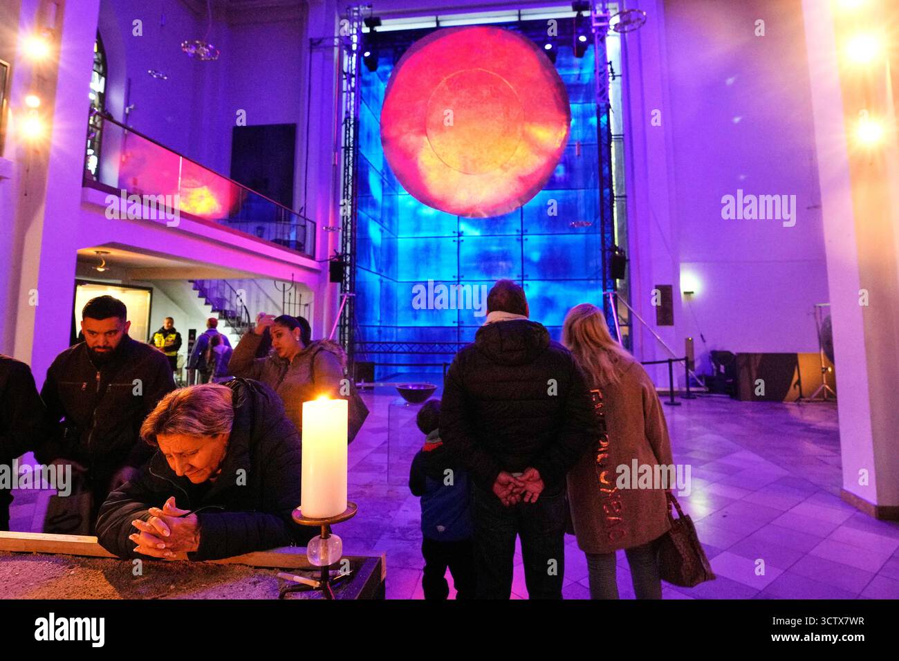 People watch an art installation in the Market church during the Essen ...