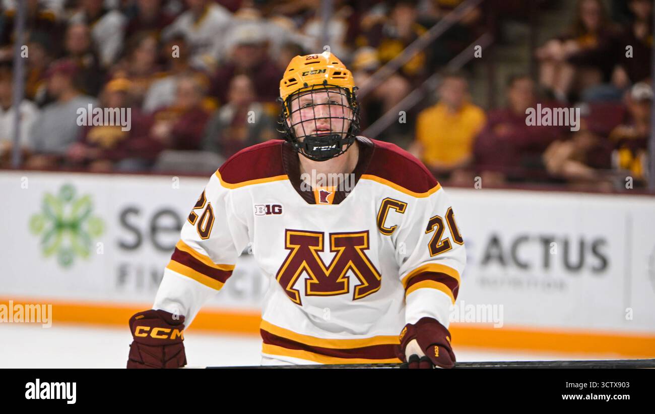 Minnesota defenseman Luke Mittelstadt skates to the puck against ...