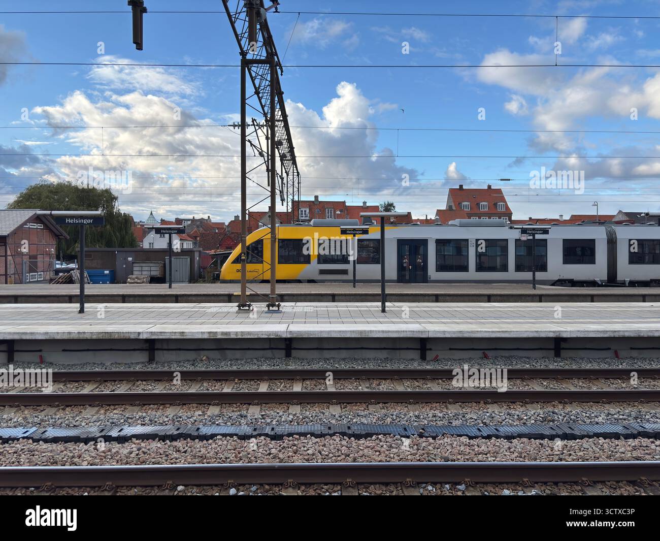 Passenger trains at Helsingor station in Denmark, with tracks and brick ...