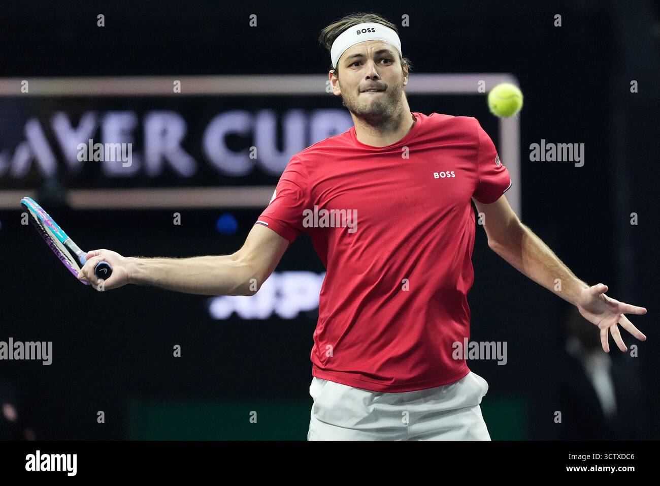 Team World's Taylor Fritz, of the United States, returns a shot against ...