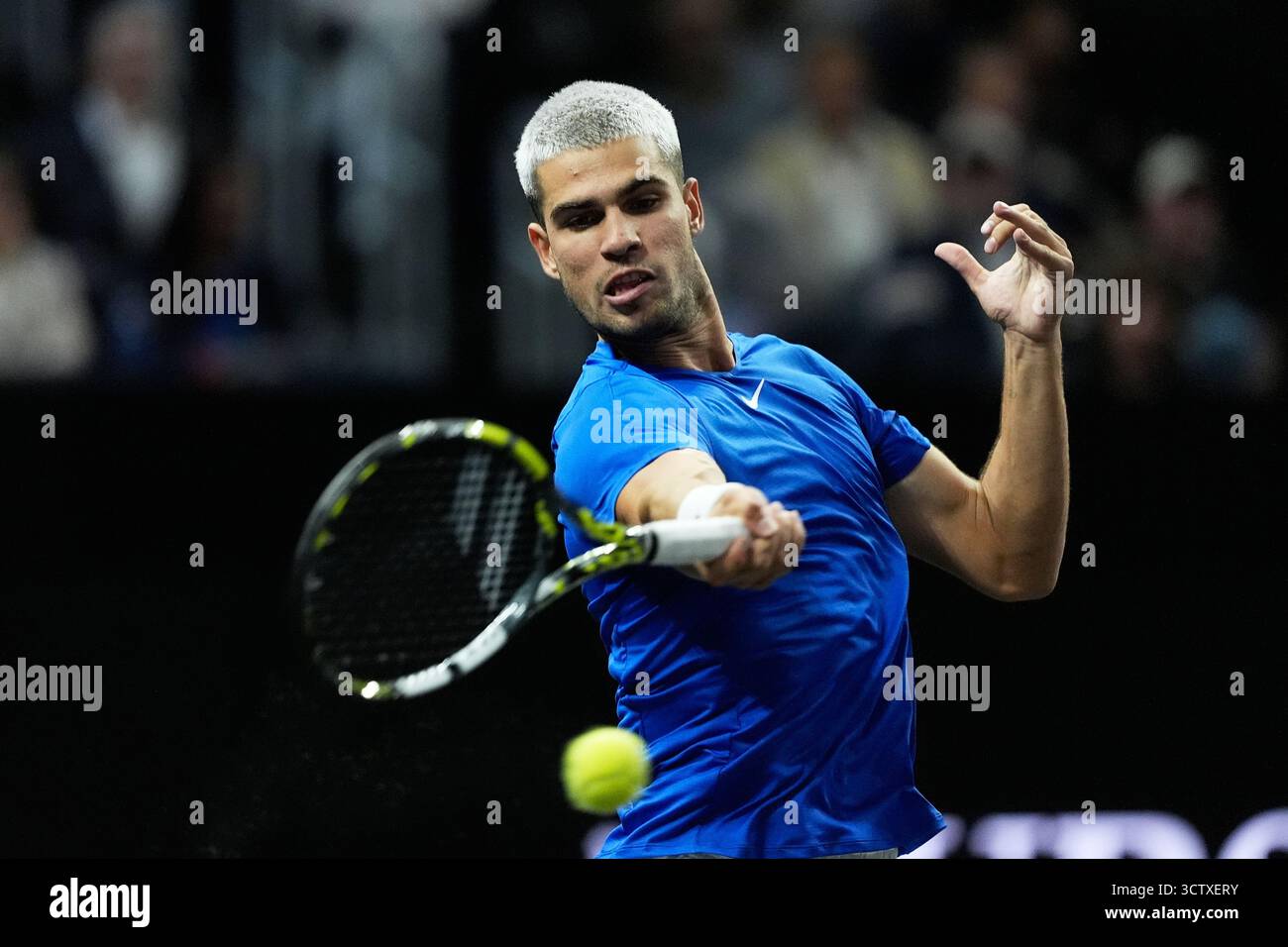 Team Europe's Carlos Alcaraz, of Spain, returns a shot during a doubles ...