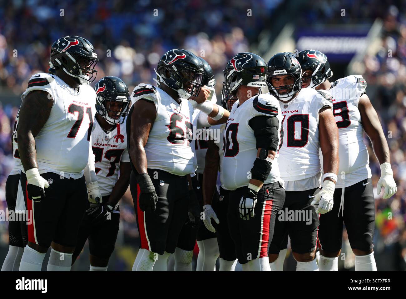 The Houston Texans huddles during the first half of an NFL football ...