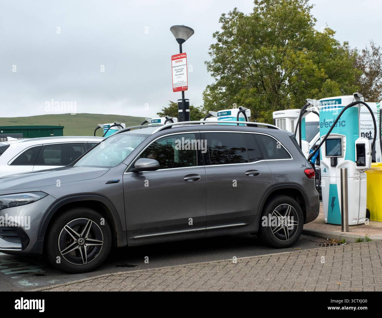 Electric car charging at the Welcome Break Abington motorway service ...