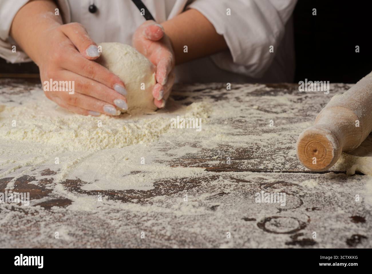 Dough. Wheat flour. Hands baker with flour in kitchen. Hands covered in ...