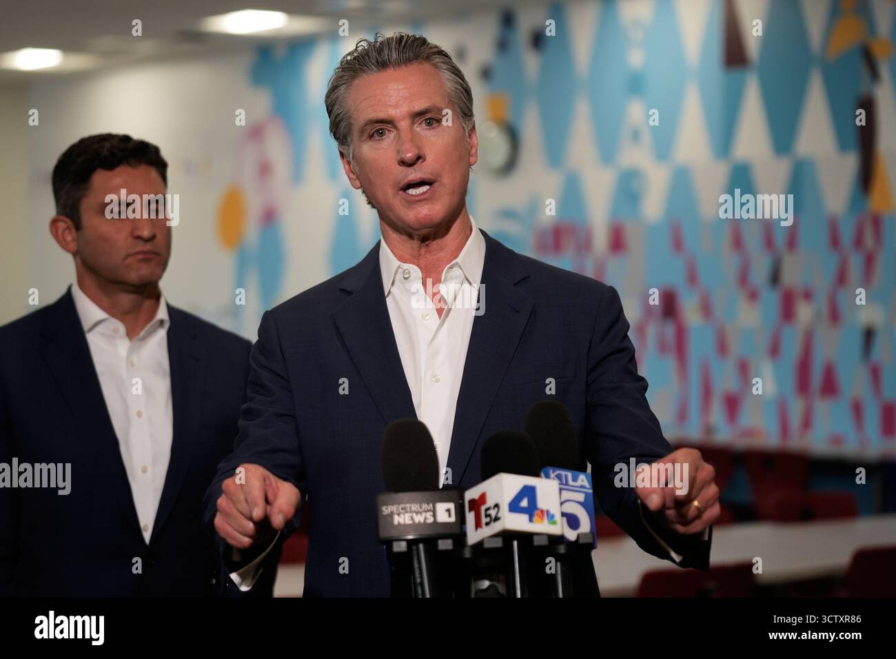 California Gov. Gavin Newsom speaks in front of Democratic Assembly ...