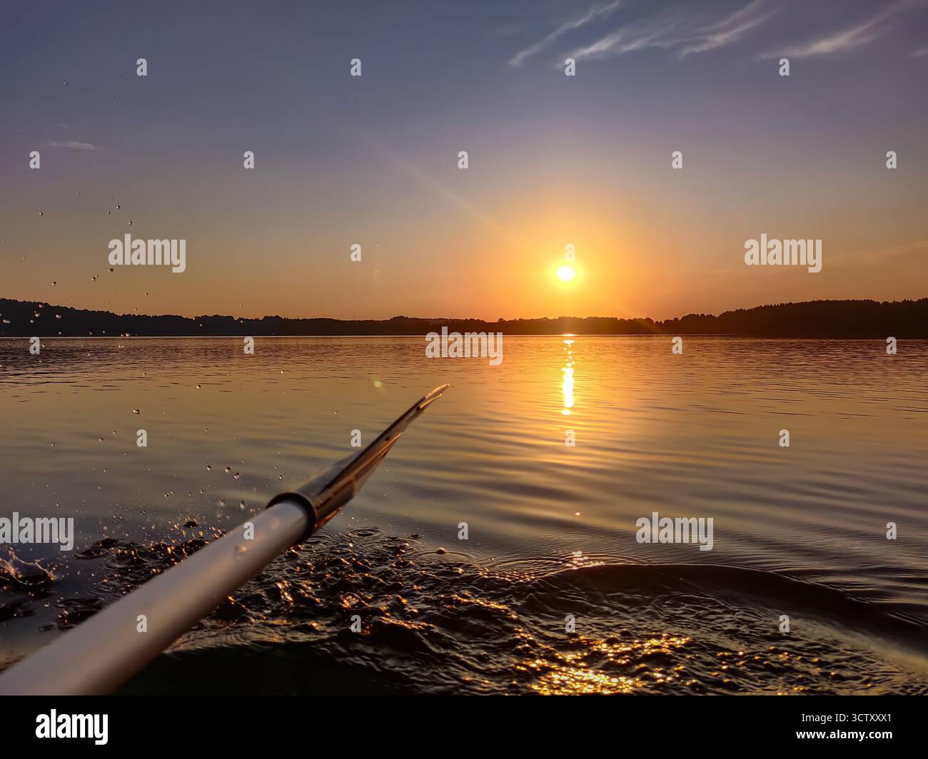 Kayaking on the lake at sunset. Kayak paddle water splash. Outdoor ...