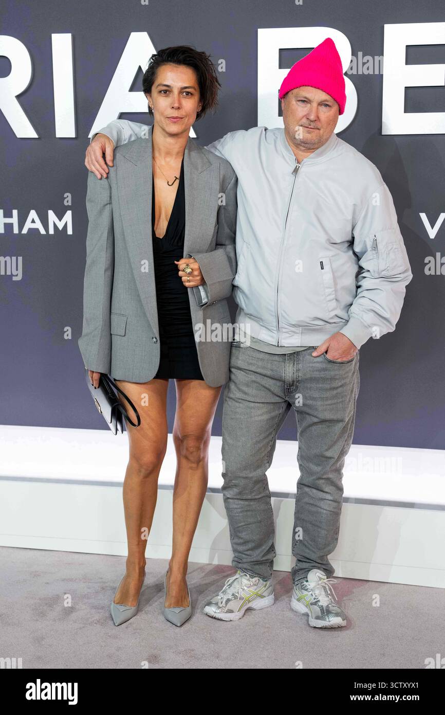 Dovile Drizyte, left, and Juergen Teller pose for photographers upon ...