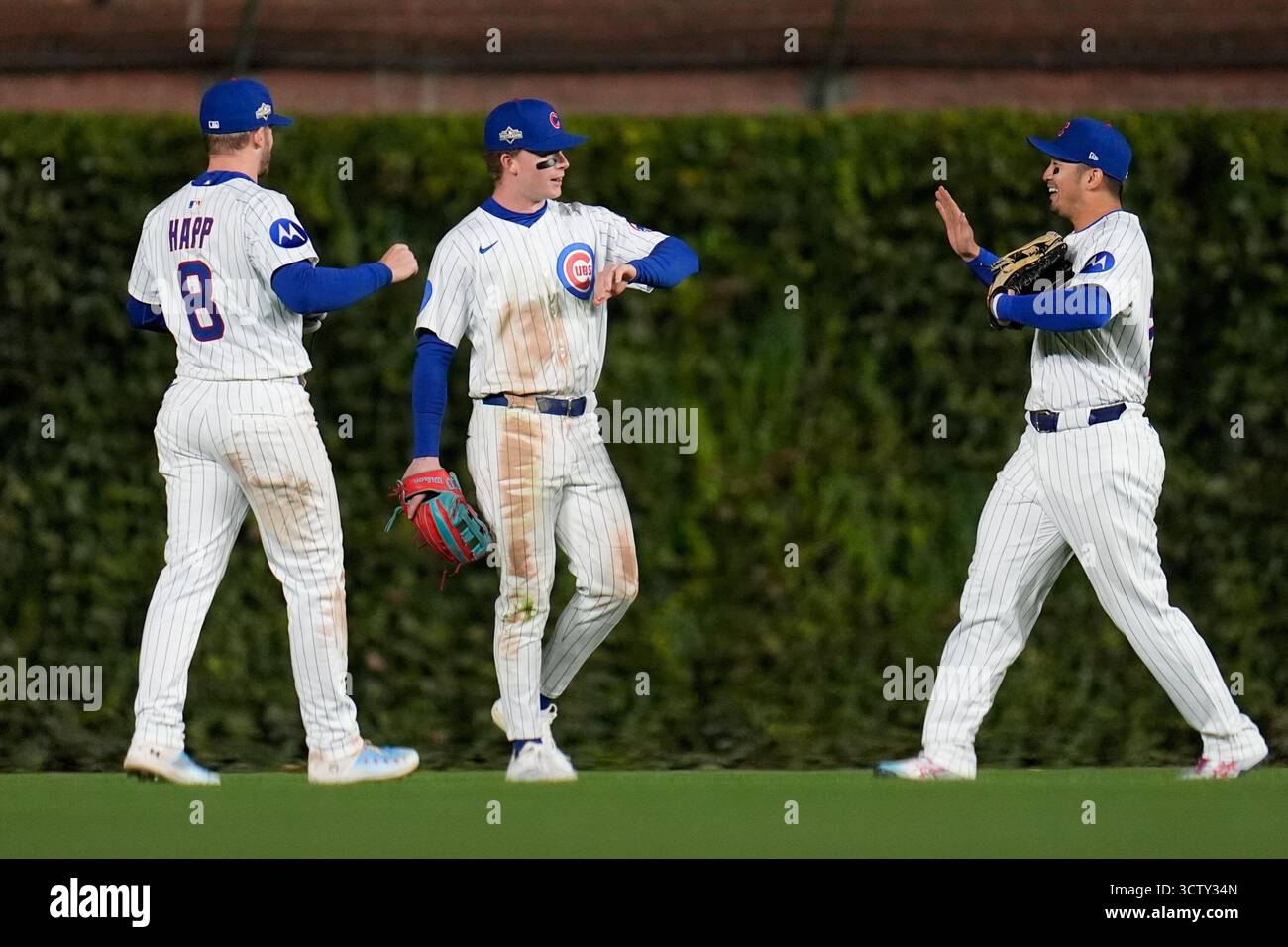 Chicago Cubs' Ian Happ, Pete Crow-Armstrong and Seiya Suzuki celebrate ...