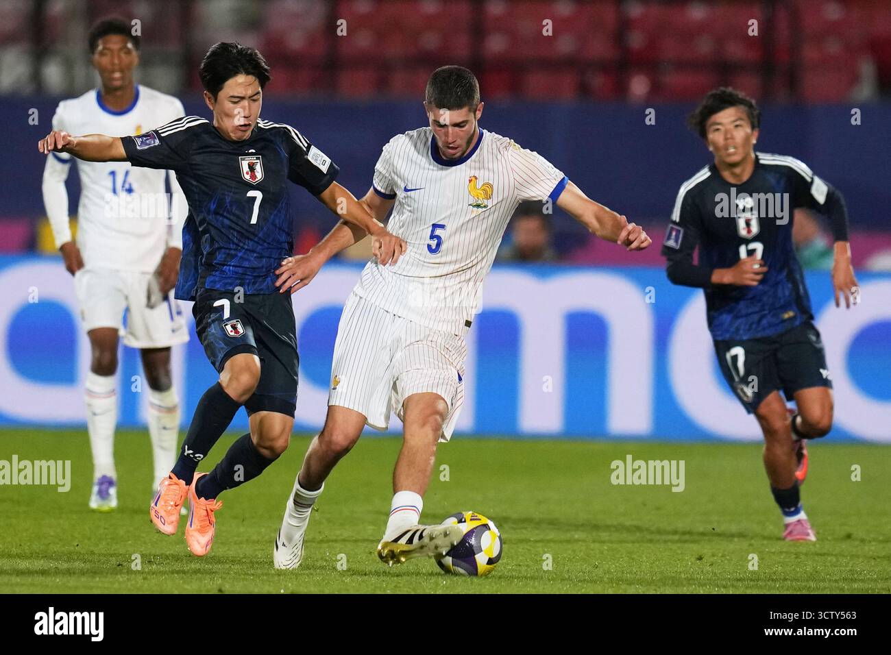 France's Elyaz Zidane (5) and Japan's Ryunosuke Sato battle for the ...