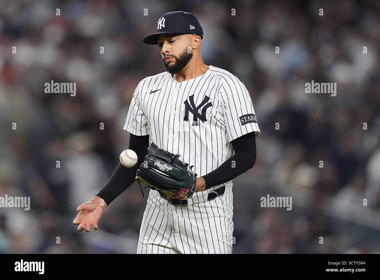 New York Yankees pitcher Devin Williams reacts after giving up a two ...