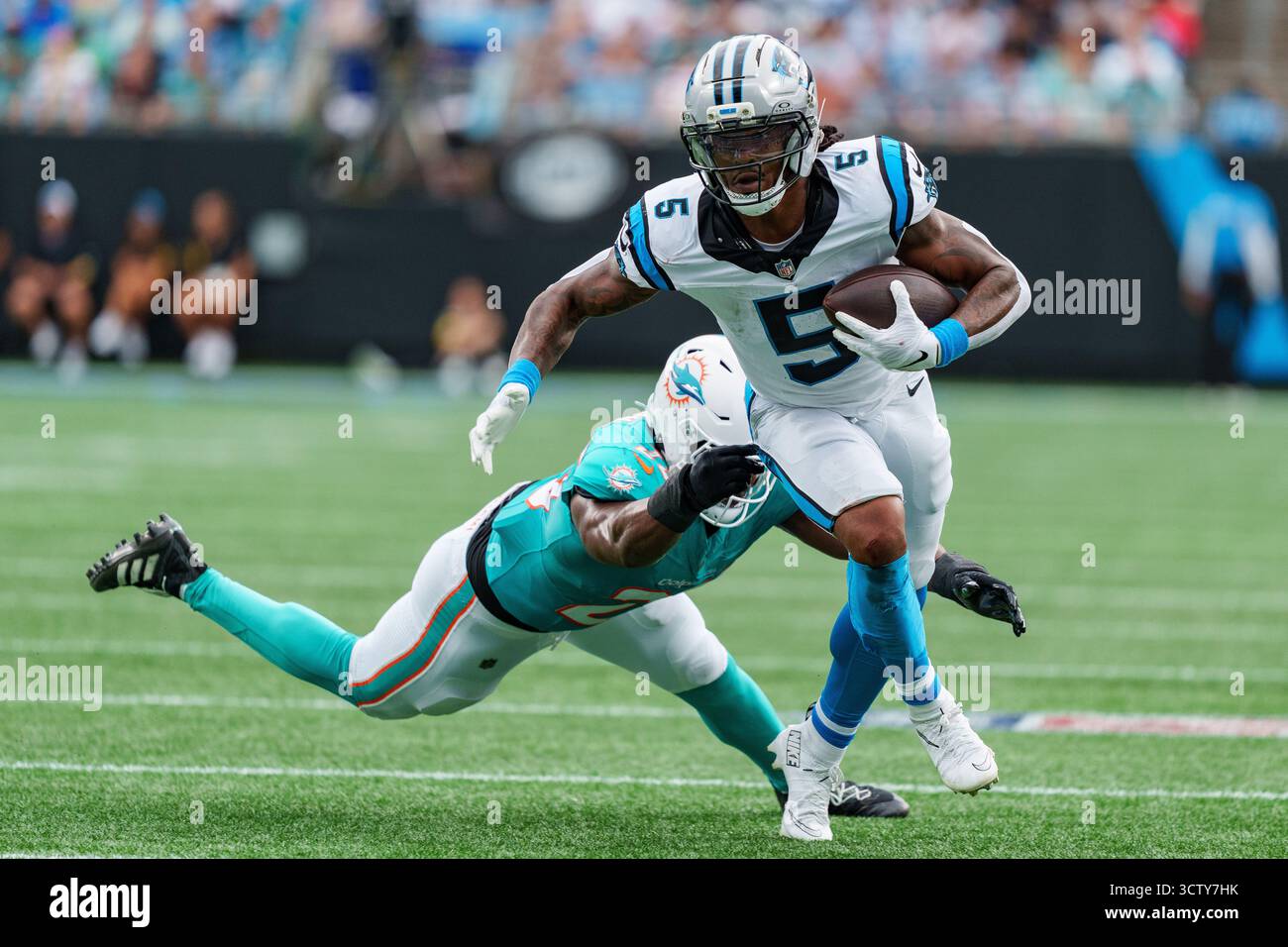 Miami Dolphins linebacker Tyrel Dodson (25) tries to tackle Carolina ...