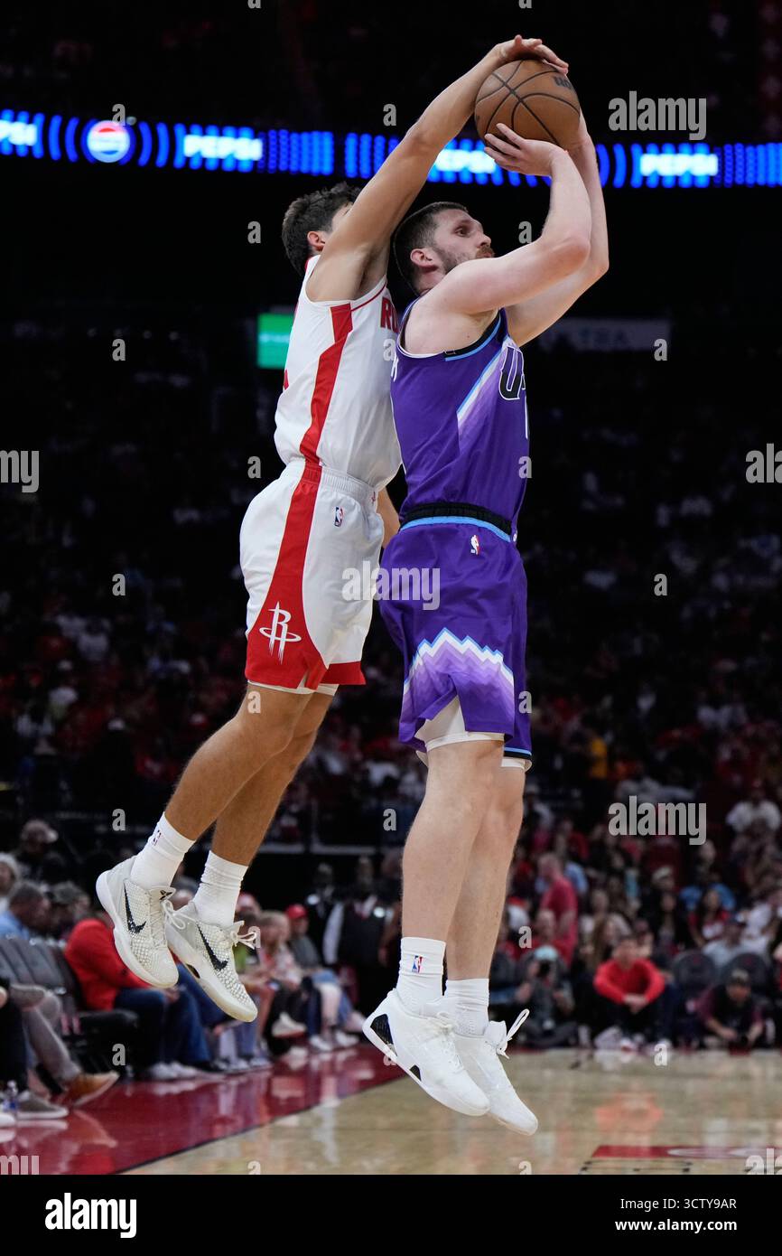 Houston Rockets guard Reed Sheppard, left, blocks a shot by Utah Jazz ...