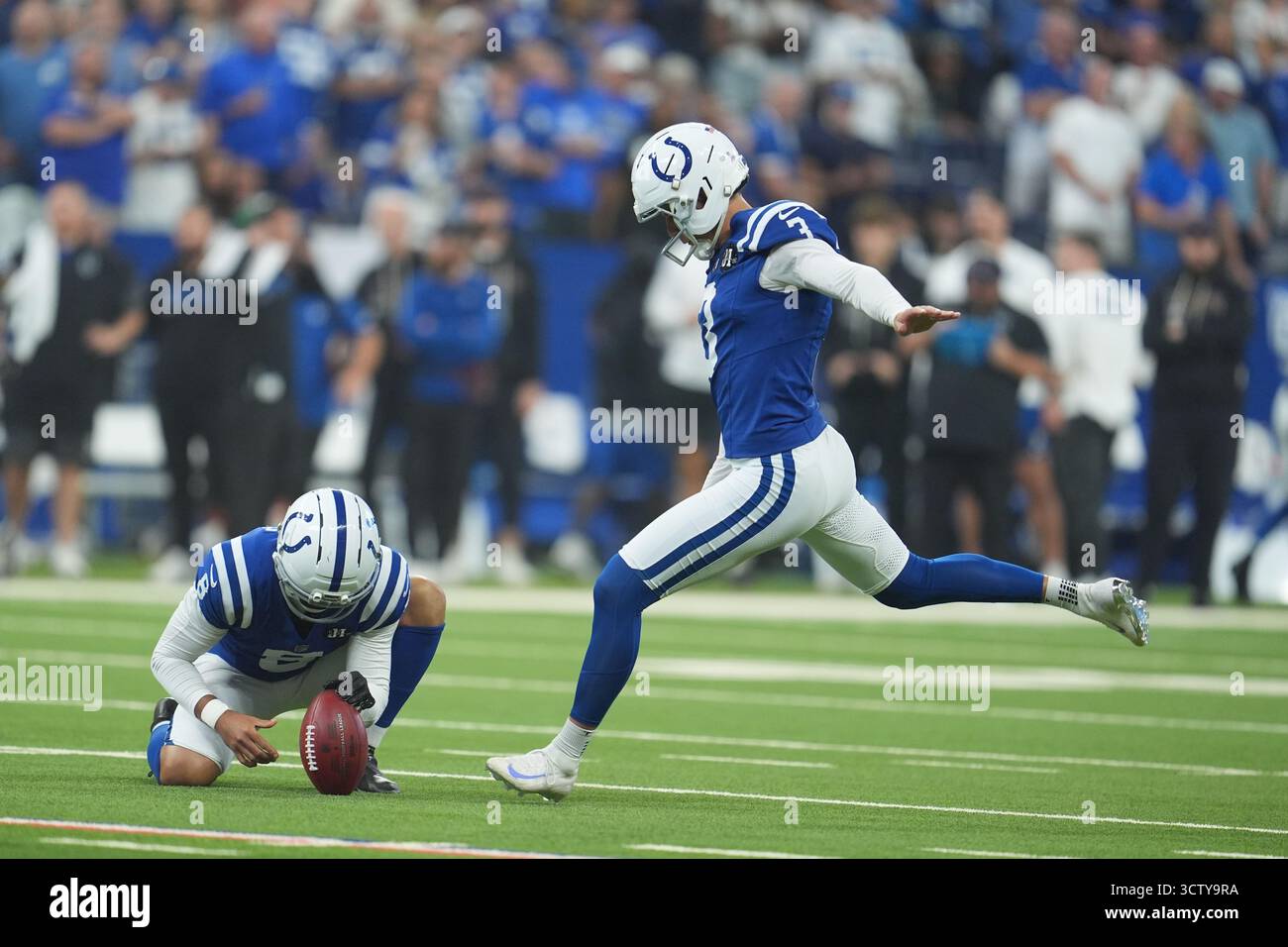 Indianapolis Colts kicker Spencer Shrader (3) kicks out of the hold of ...
