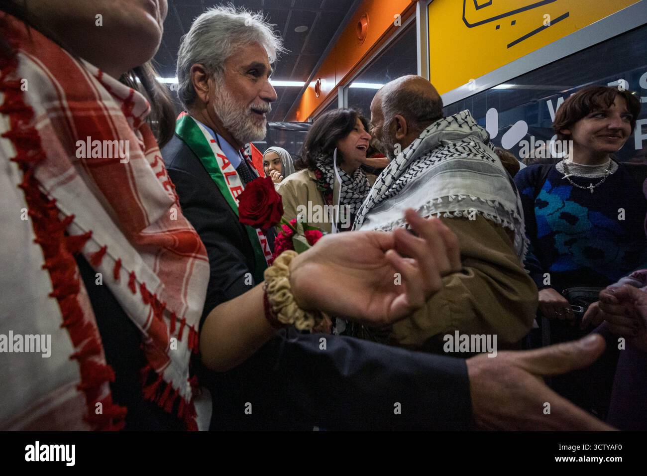 The Palestinian ambassador to Poland, Mahmoud Khalifa (left) greets the ...