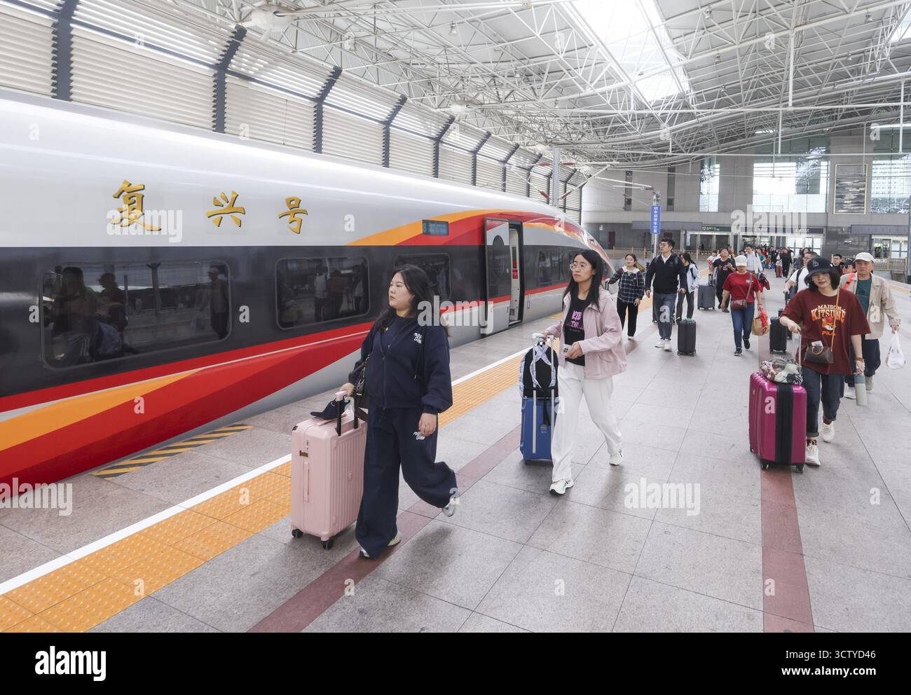 **CHINESE MAINLAND, HONG KONG, MACAU AND TAIWAN OUT** Passengers crowd Beijing North Railway ...