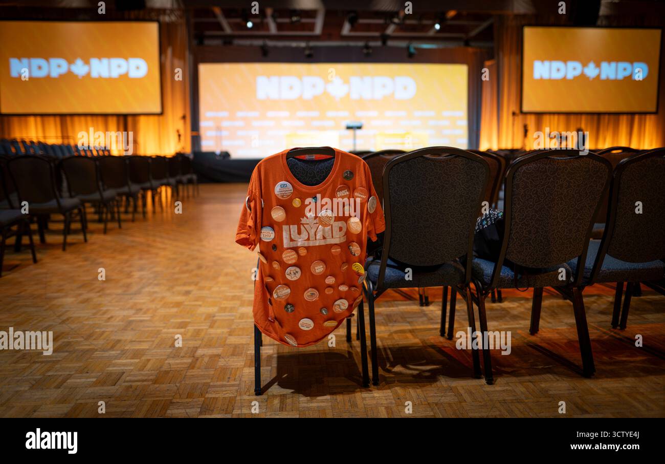 An NDP shirt with various campaign pins is shown at the NDP Convention ...