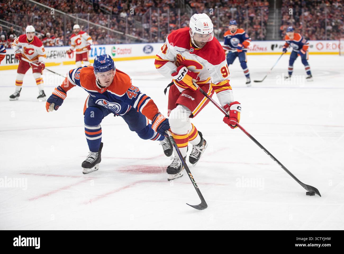Calgary Flames' Nazem Kadri (91) and Edmonton Oilers' Ty Emberson (49 ...