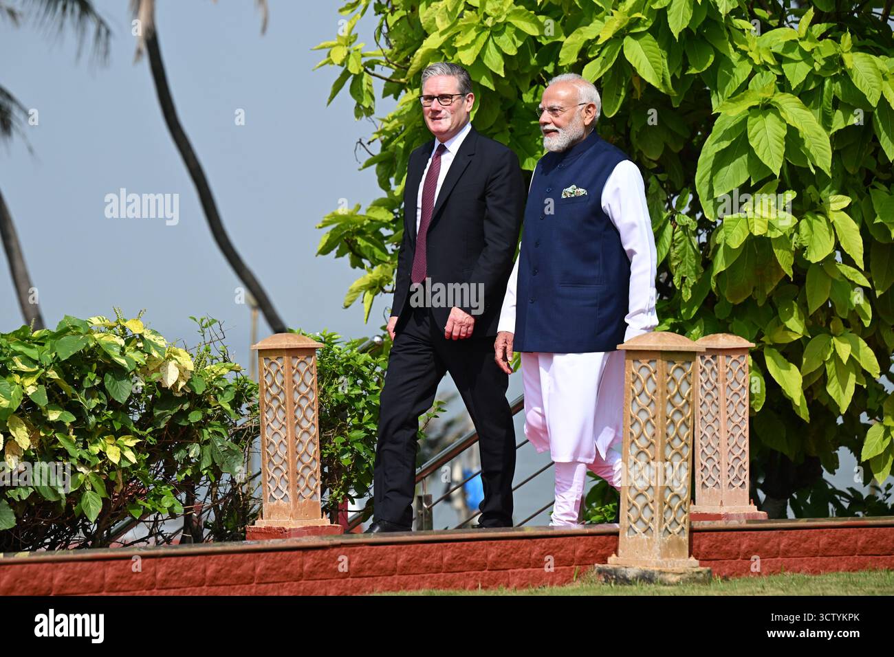 British Prime Minister Sir Keir Starmer, left and Indian Prime Minister ...