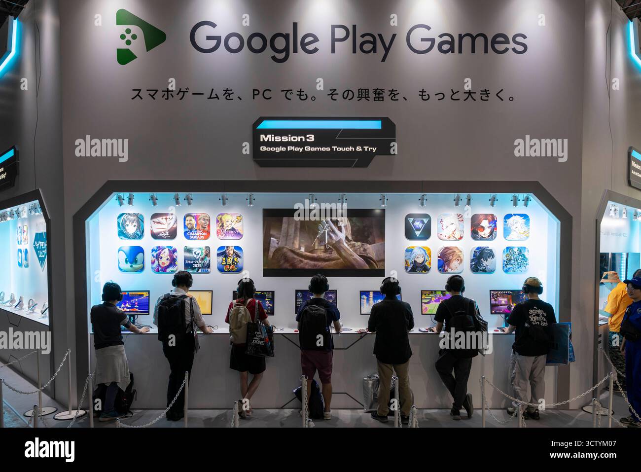Visitors play online games at the Google Play exhibition area at the Tokyo Game Show 2025. The ...