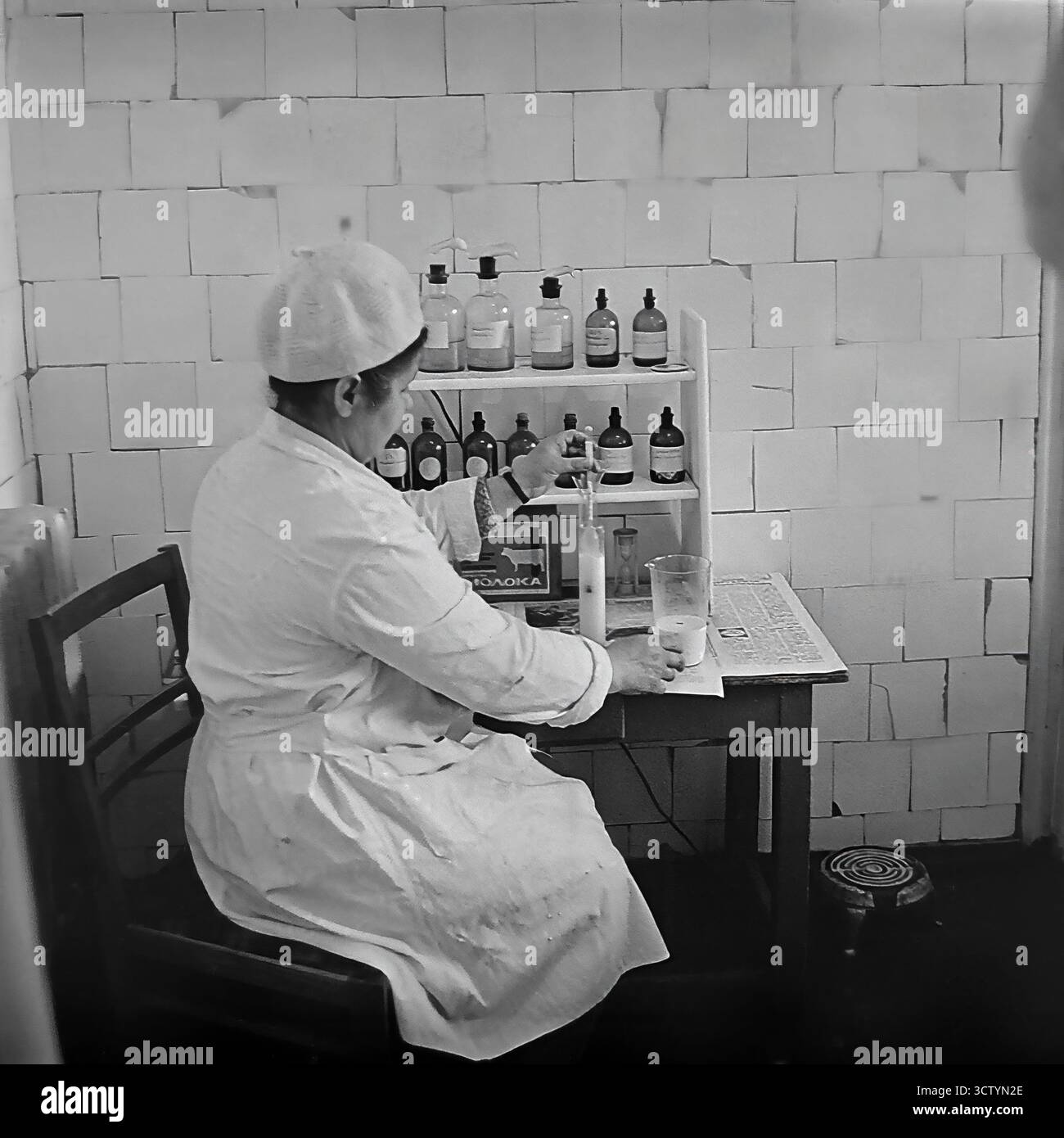 Woman laboratory technician sits table hi-res stock photography and ...