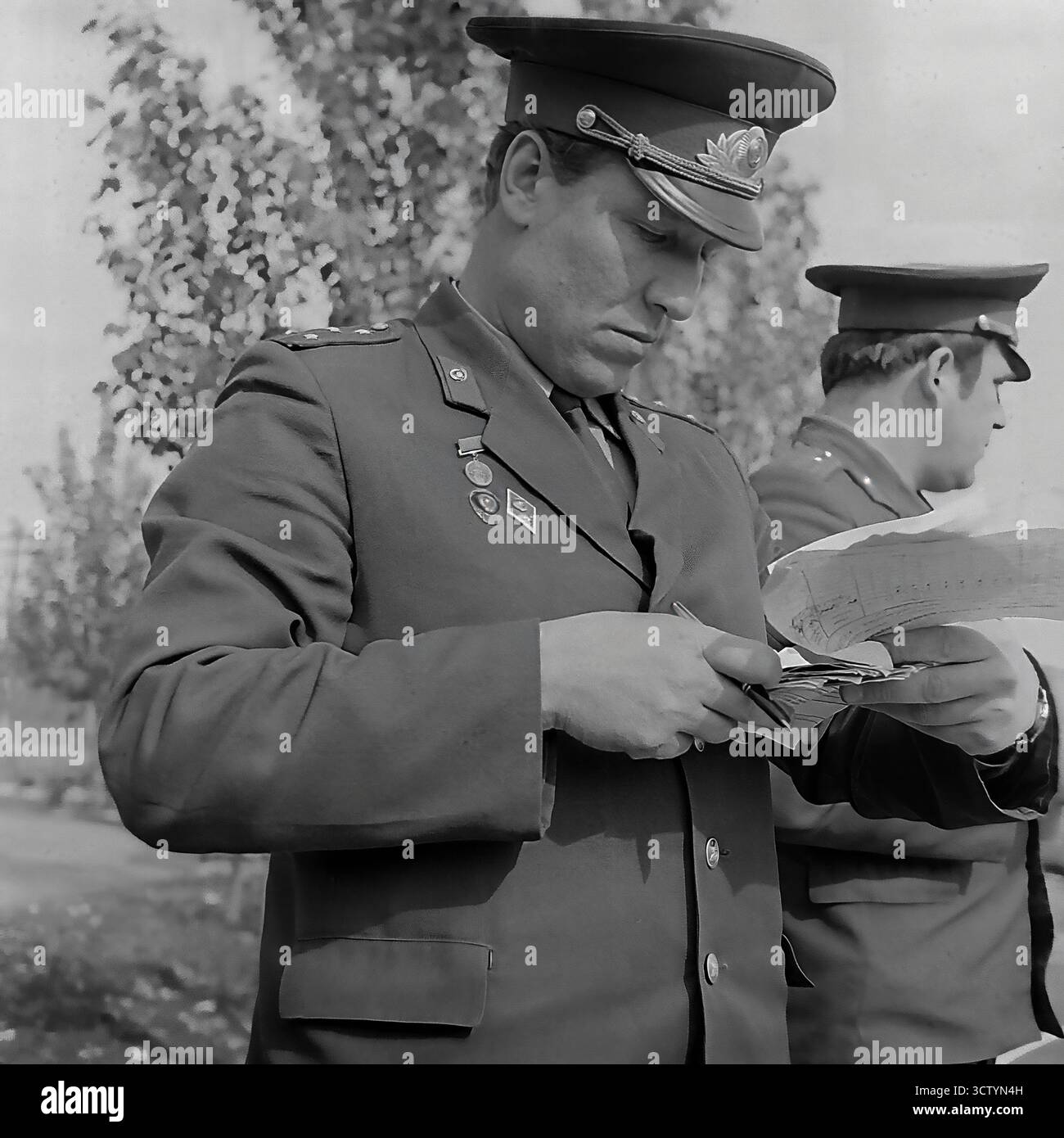 A candid portrait of a Soviet GAI (traffic police) officer at work in ...