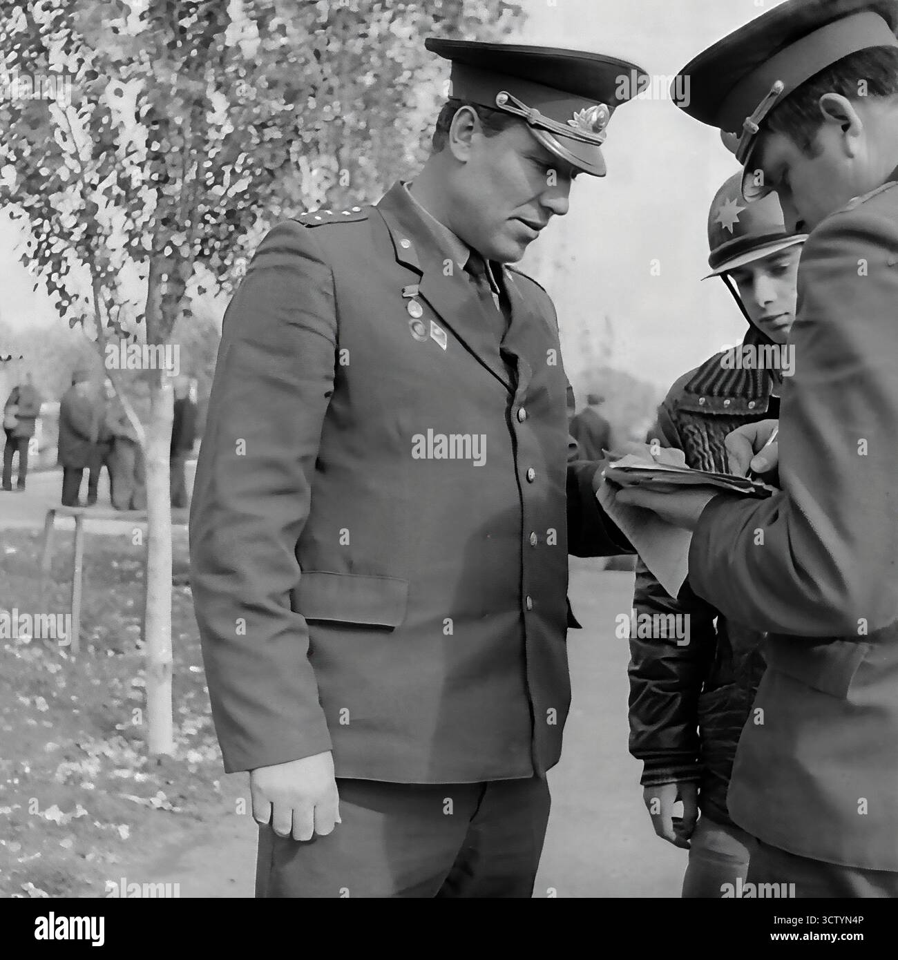 A candid portrait of a Soviet GAI (traffic police) officer at work in ...