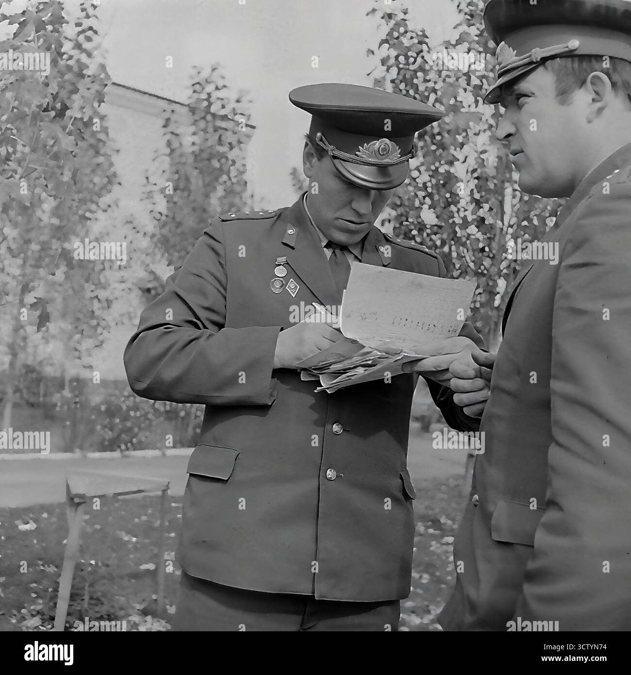 A candid portrait of a Soviet GAI (traffic police) officer at work in ...