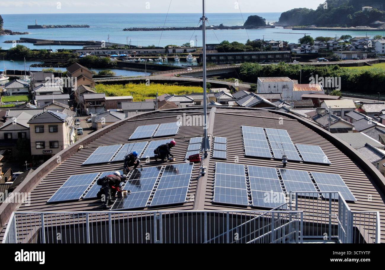 Solar panels are installed on the roof of a tsunami evacuation tower in ...