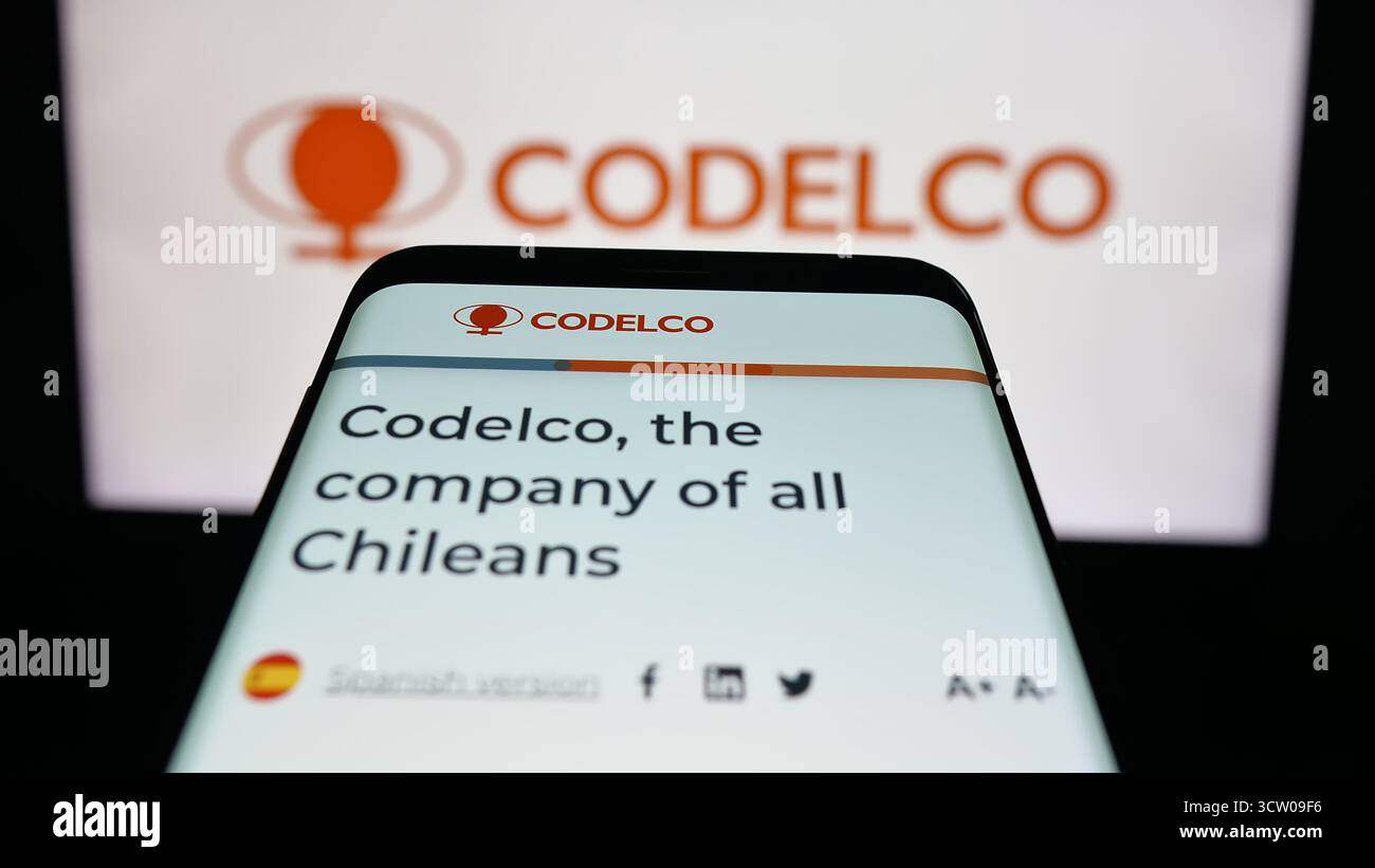 In this photo illustration, a mobile phone with the website of Chilean copper mining company ...