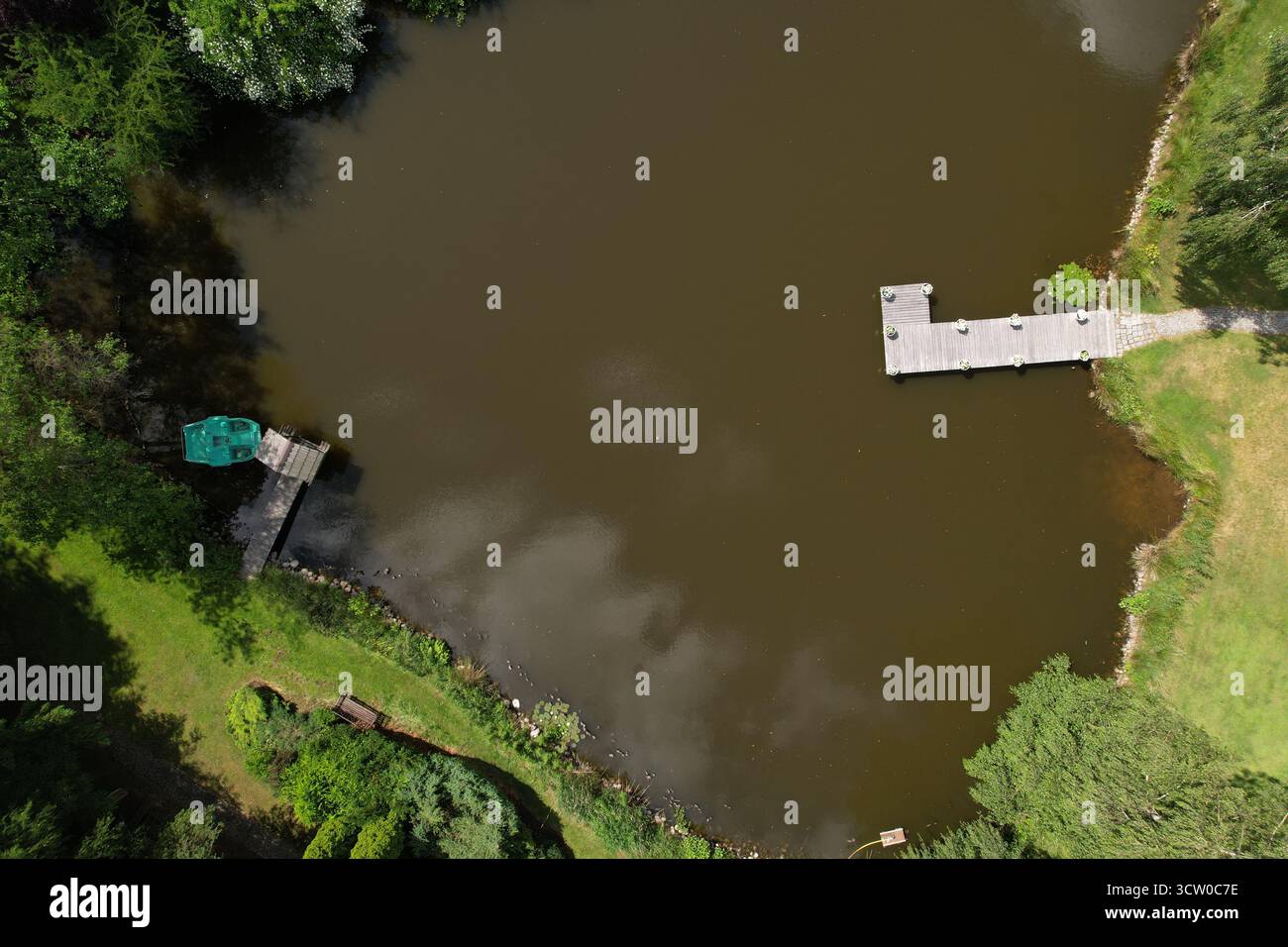 Overhead lake with wooden pier, Hotel Kozi Grod Pomlewo, midday ...