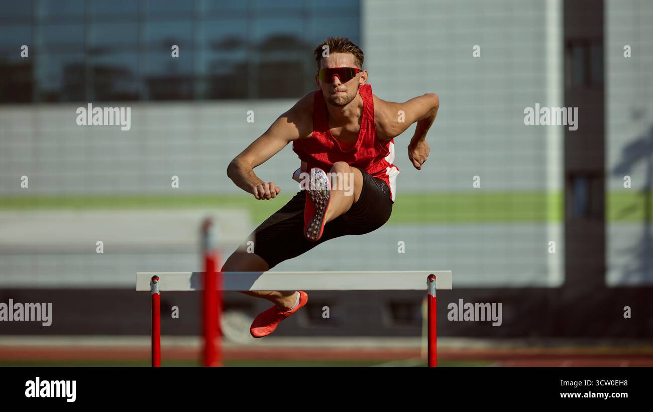Hurdler in mid air hi-res stock photography and images - Alamy