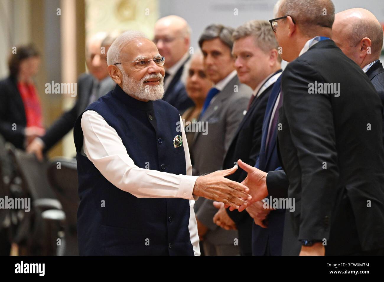 Indian Prime Minister Narendra Modi greets delegates during the India ...
