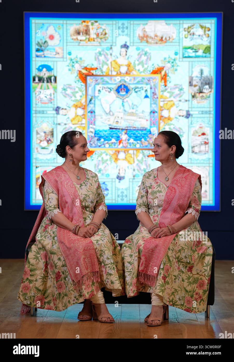 EDITORIAL USE ONLY The Singh Twins alongside their light box art work ...