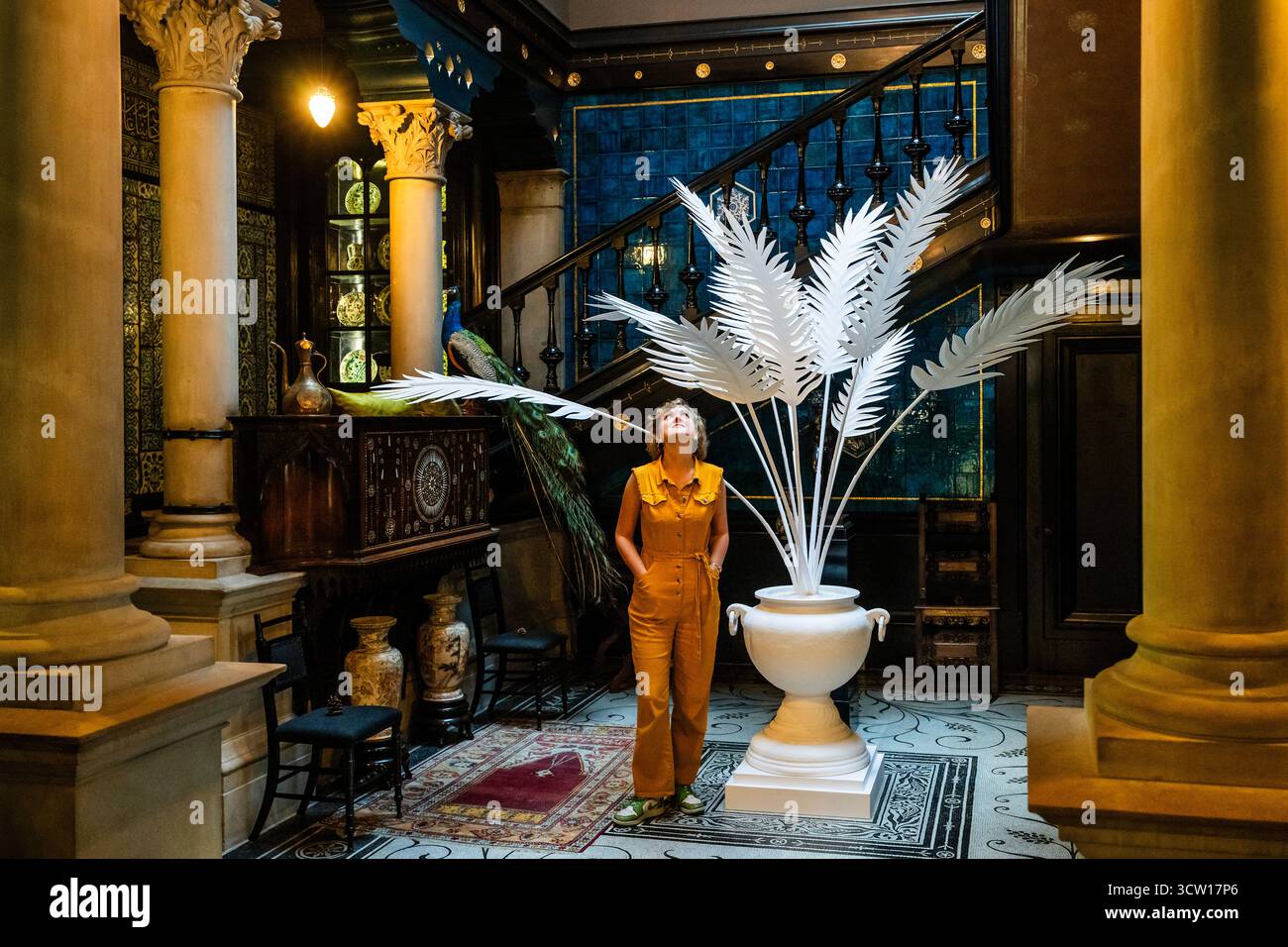London, UK. 9th Oct, 2025. The artist with her large fern inside a ...
