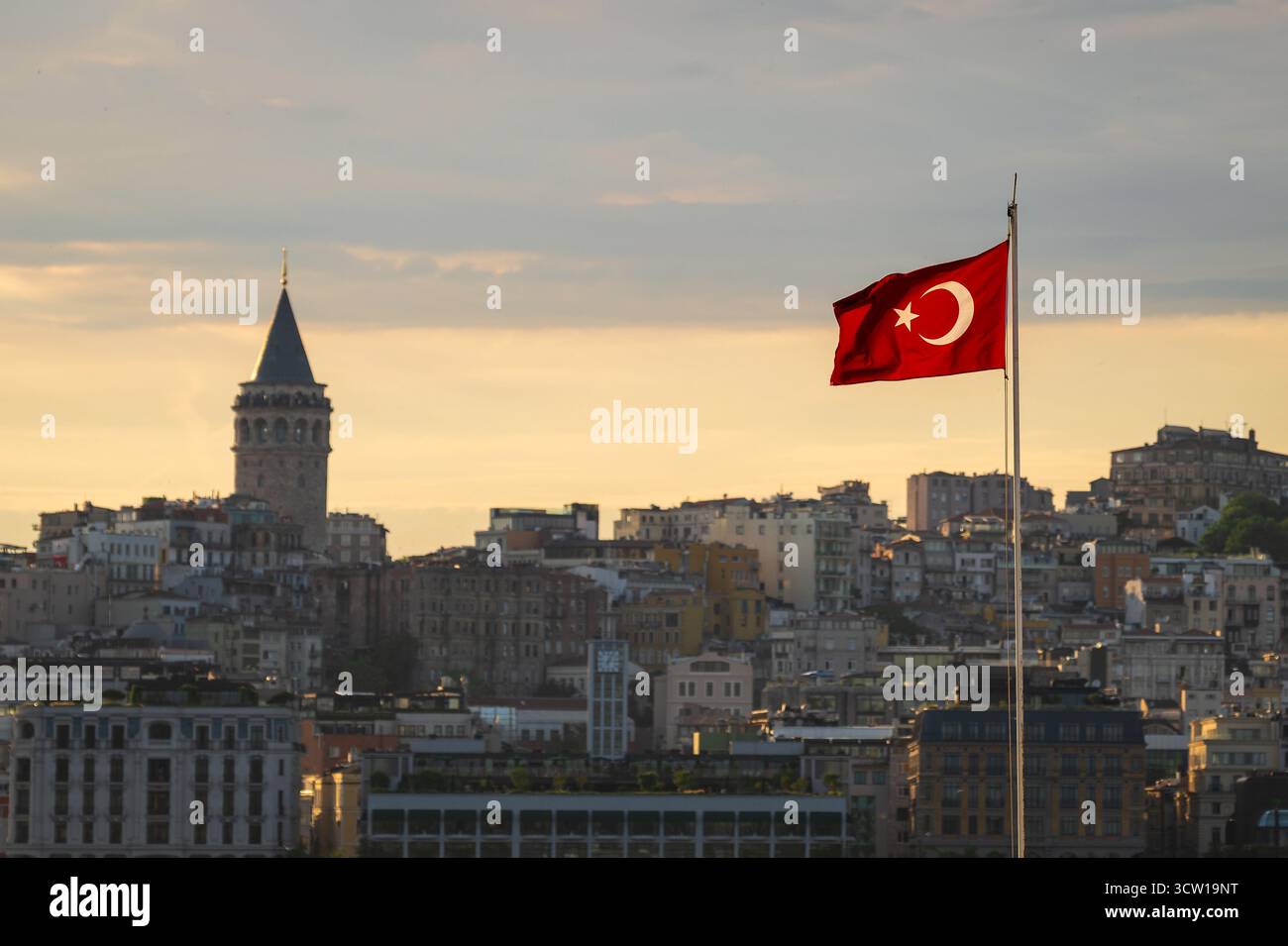 The Turkish flag, flying proudly over the Bosphorous, in Istanbul, with ...