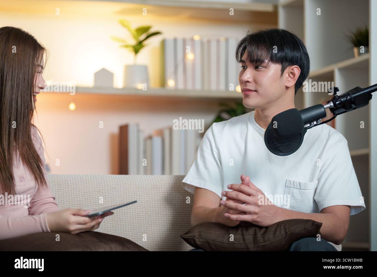 Young influencers recording podcast discussion hi-res stock photography ...