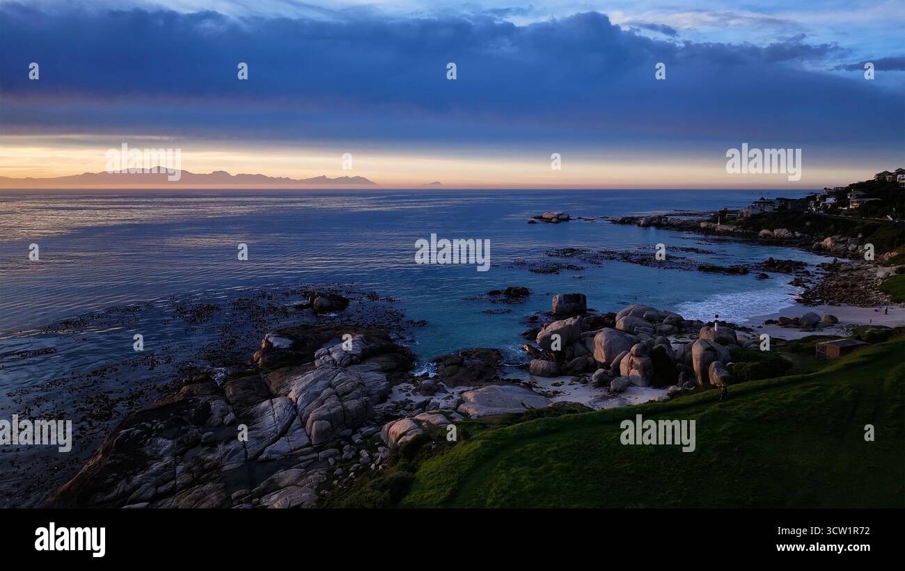 Aerial view of the sun's fading glow kissing the horizon over the ...