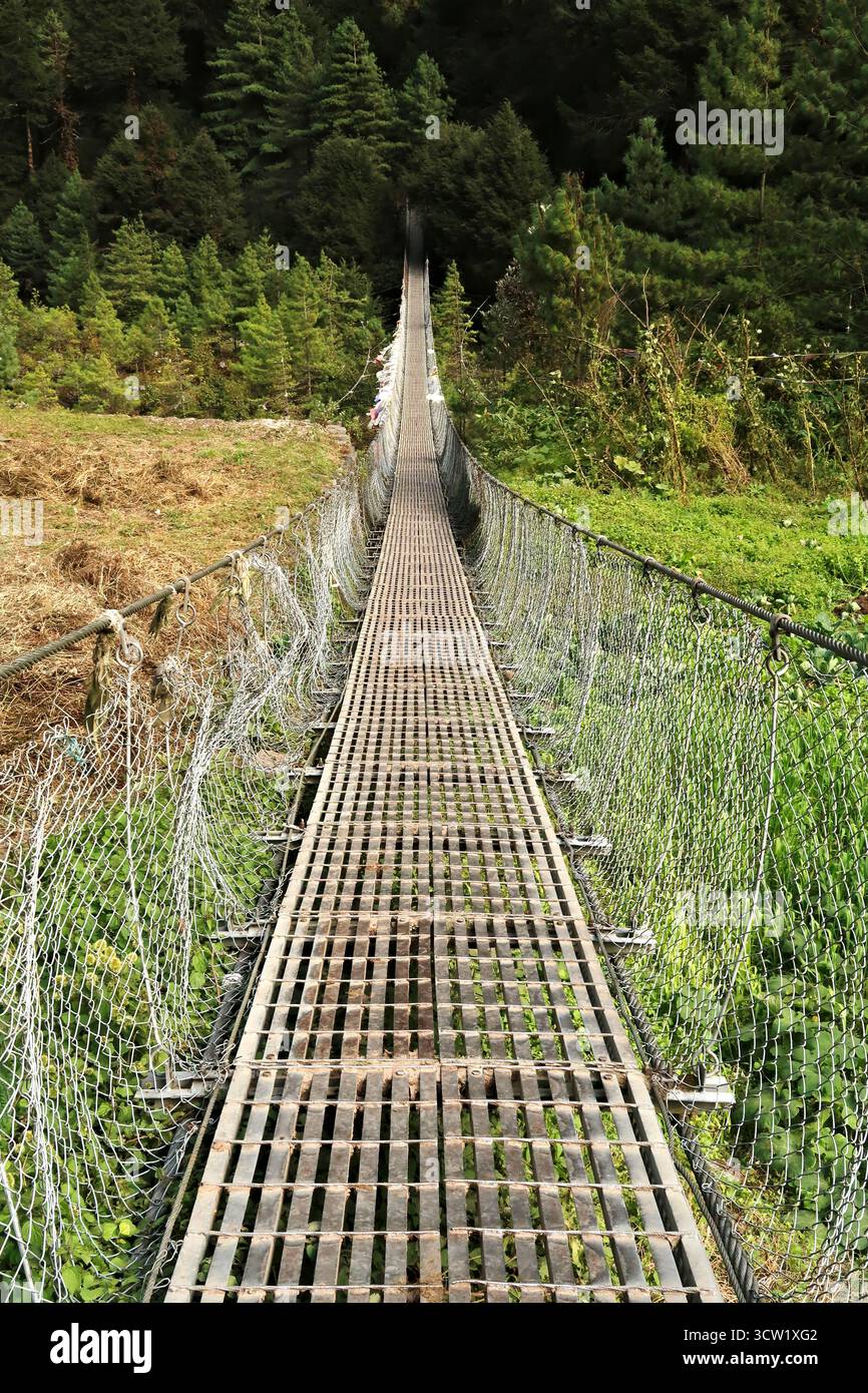 The Benkar-Manjo bridge, a long metal suspension bridge connecting the ...