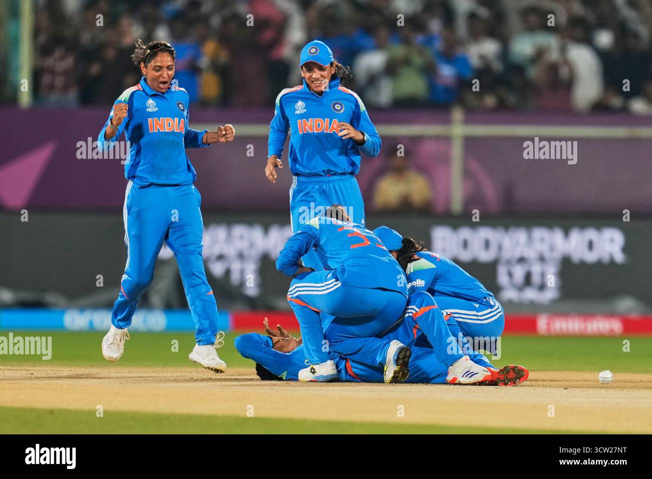 India's captain Harmanpreet Kaur, left, and others celebrate with ...