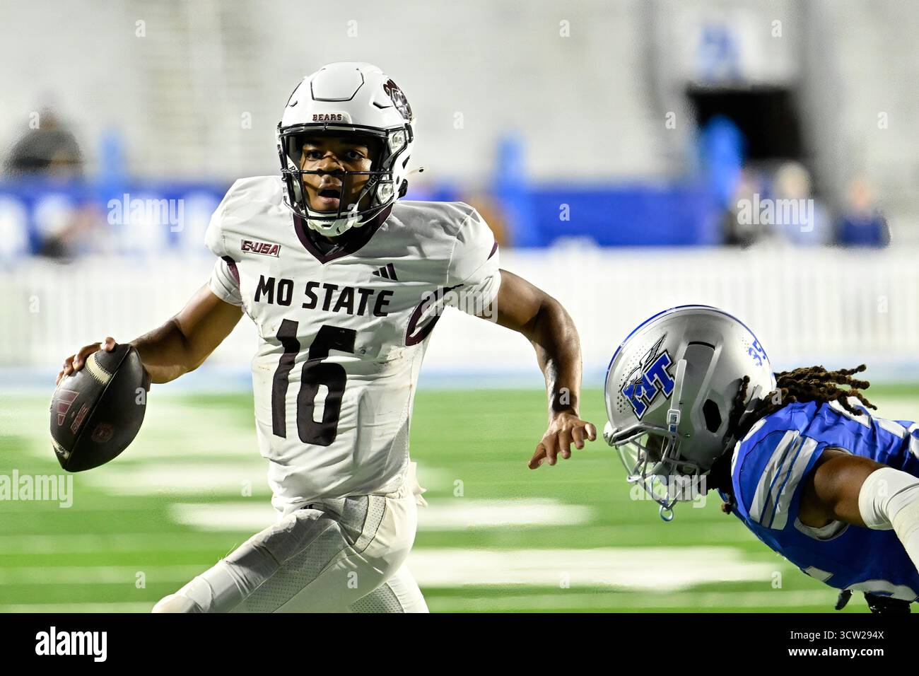 Missouri State quarterback Deuce Bailey (16) tries to evade the defense ...