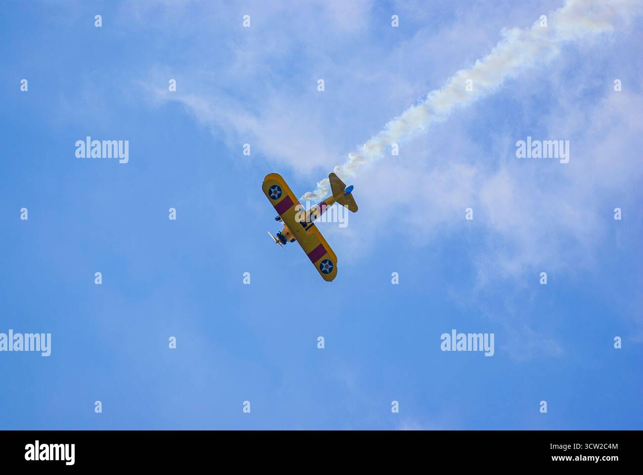 A Boeing Stearman biplane during a flight demonstration at an air show ...