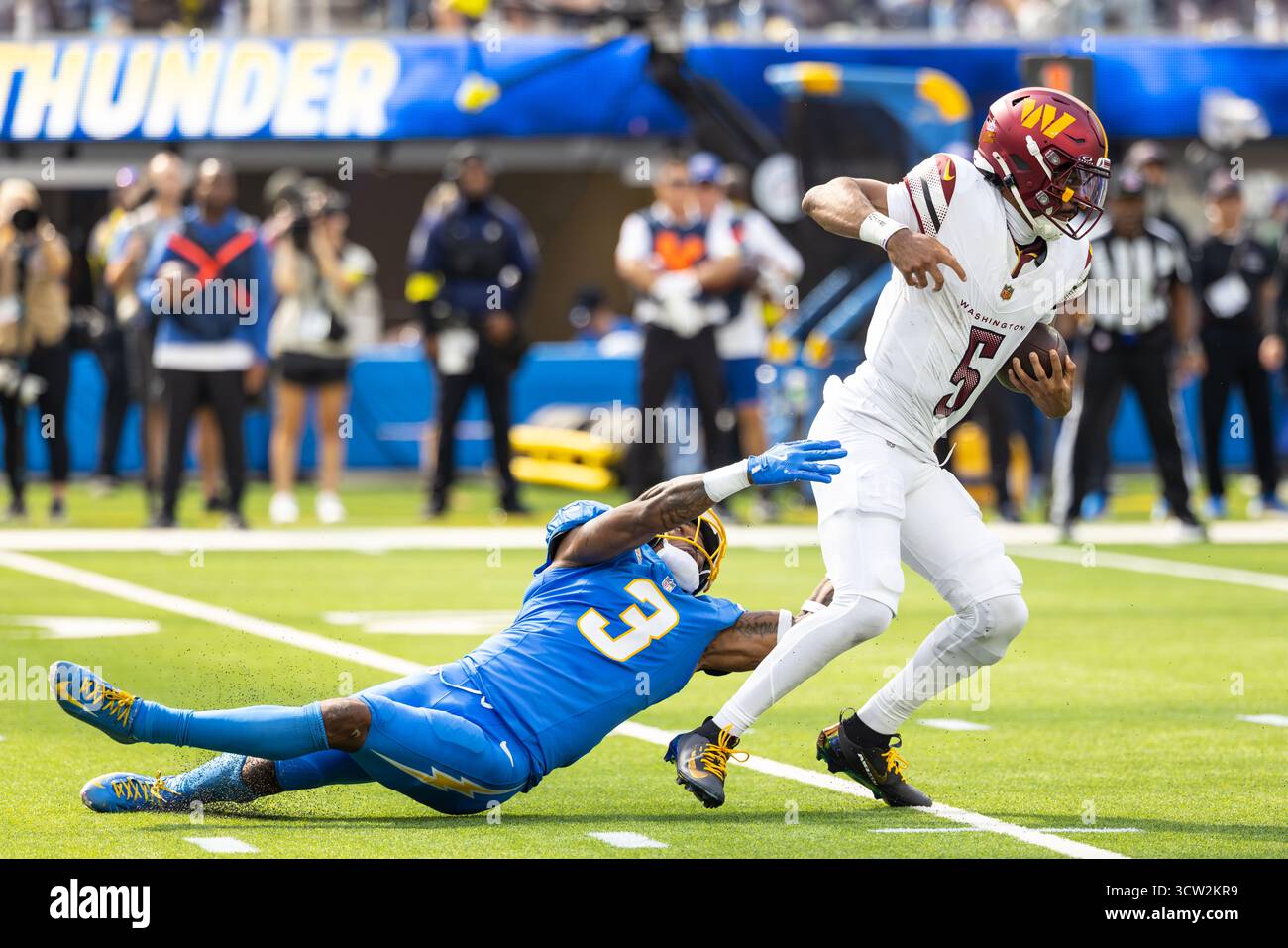 Washington Commanders quarterback Jayden Daniels (5) with the carry ...