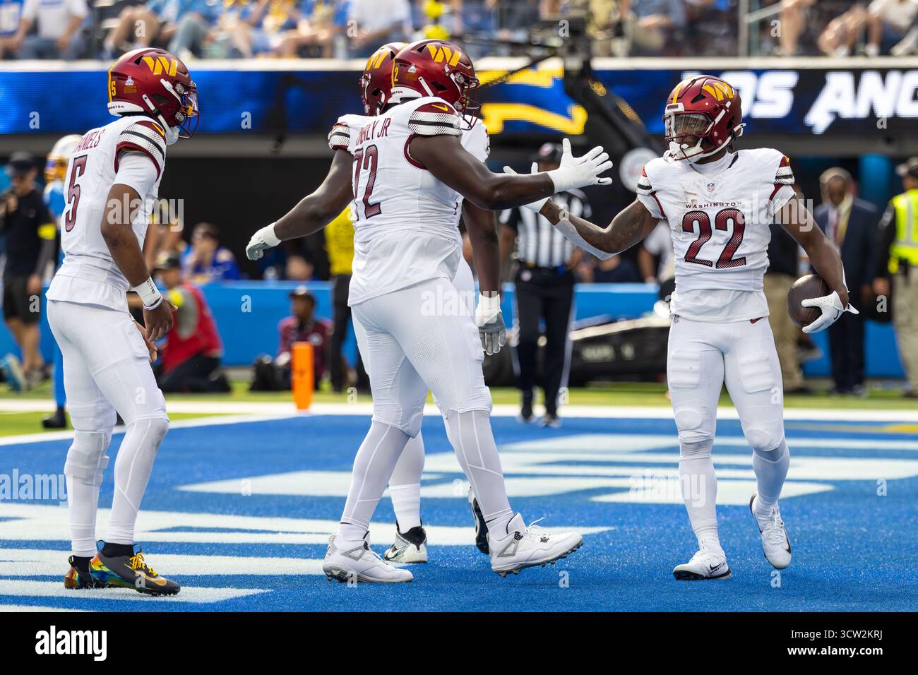 Washington Commanders running back Jacory Croskey-Merritt (22) scores a ...