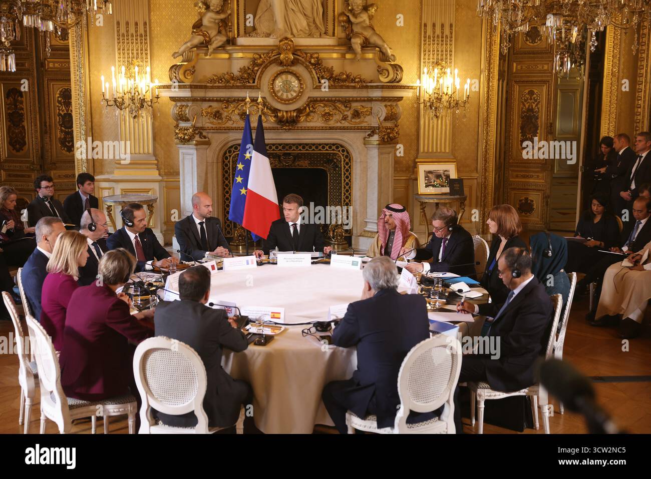 France's President Emmanuel Macron, center, speaks during the meeting ...